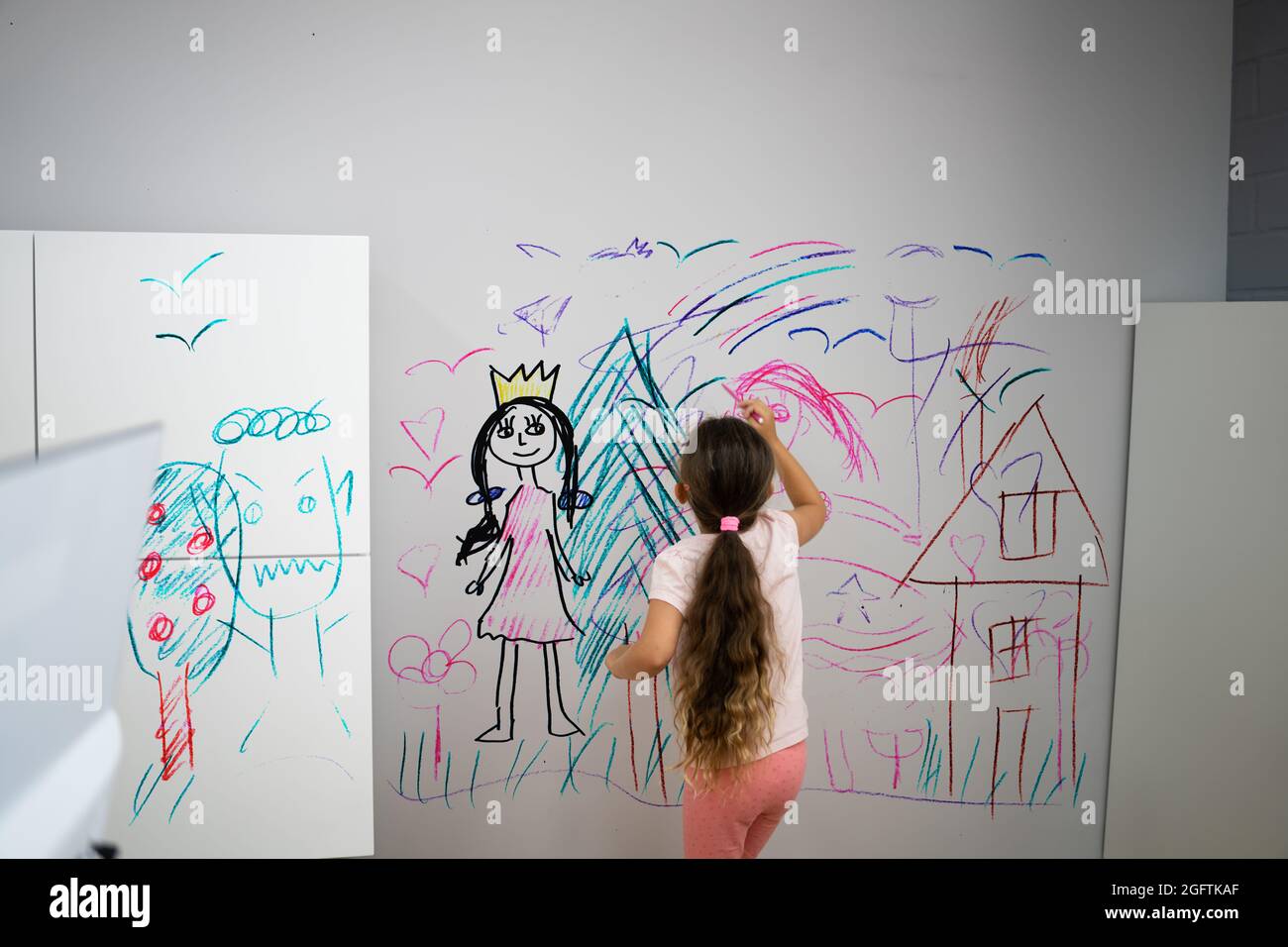 Little Child Girl Drawing. Cute Kid Having Fun Stock Photo - Alamy