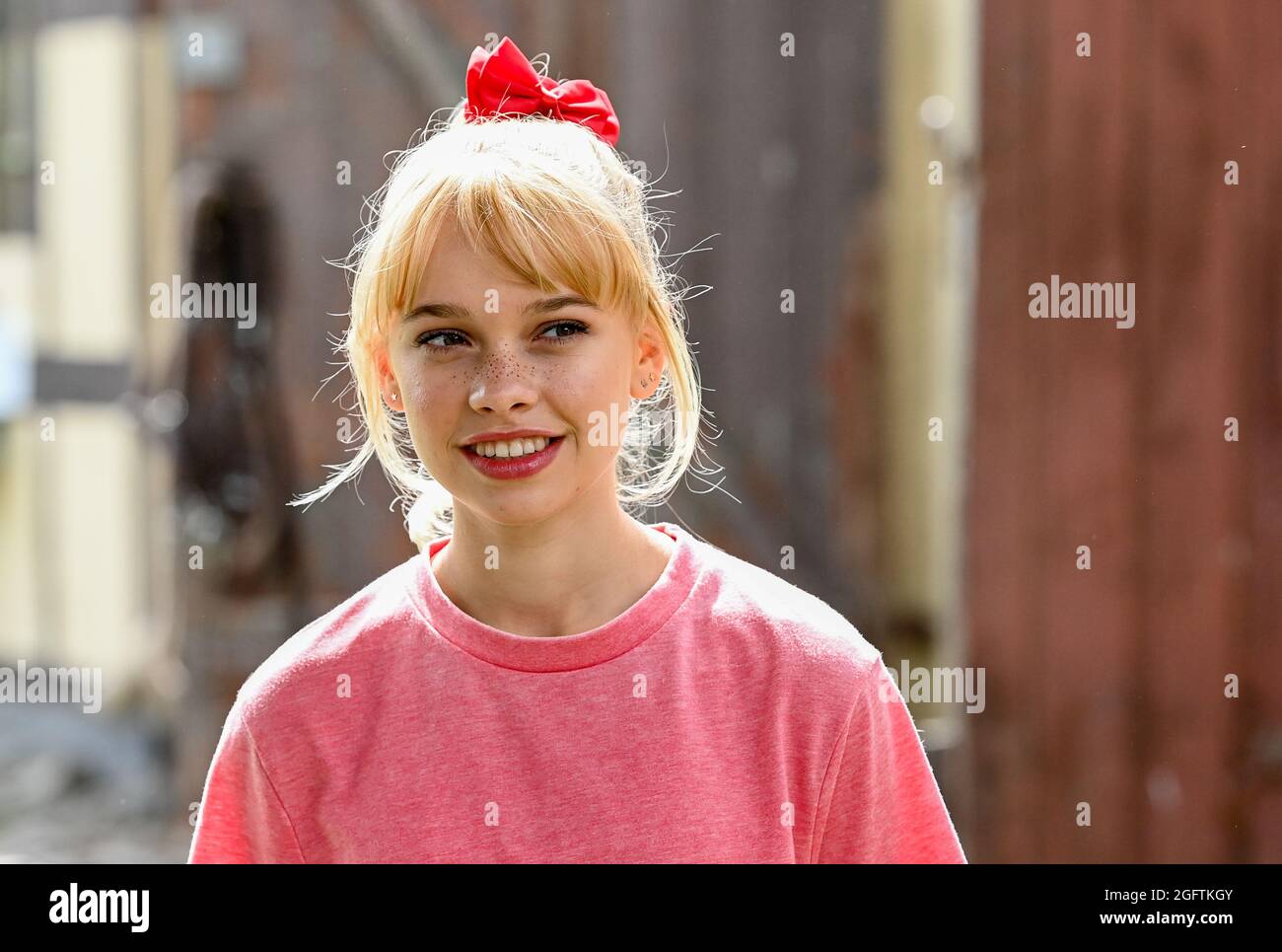 Berlin, Germany. 16th Aug, 2021. Actress Katharina Hirschberg as Bibi cuddles with her grey mare ...