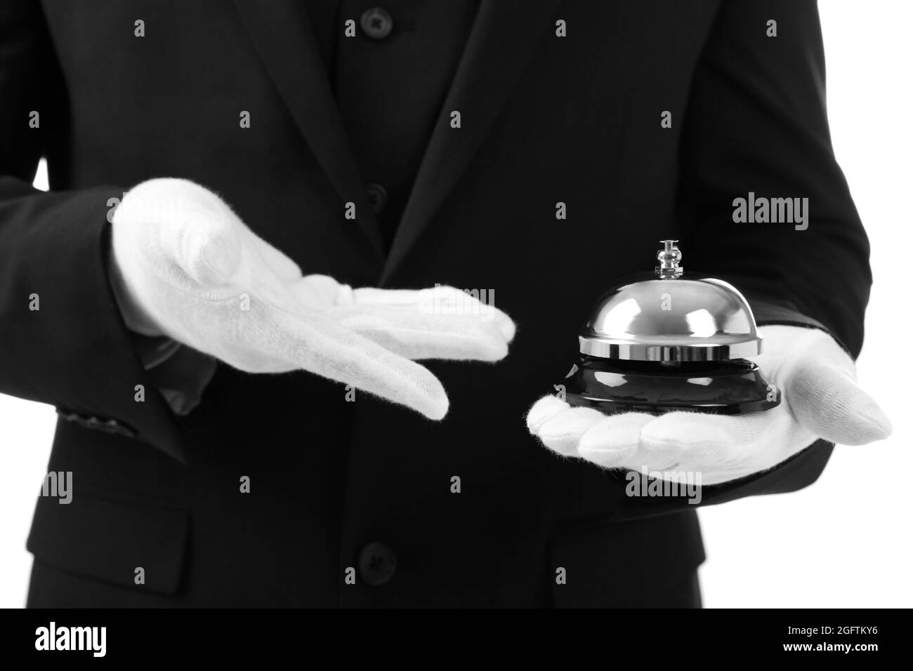 Male waiter holding bell on white background Stock Photo - Alamy