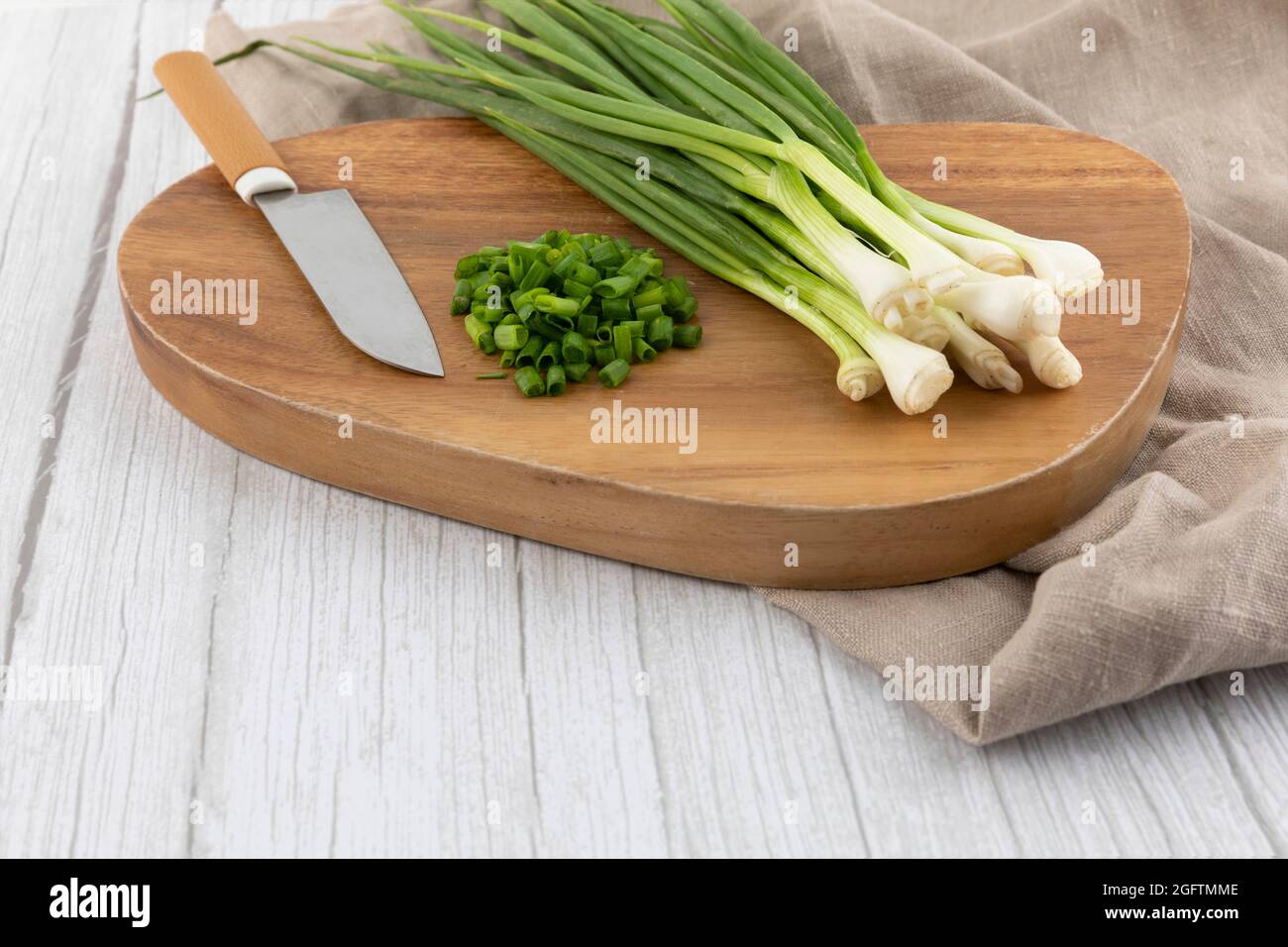 green spring onion on chopping board Stock Photo - Alamy