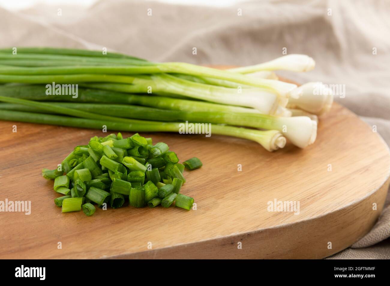 green spring onion on chopping board Stock Photo - Alamy