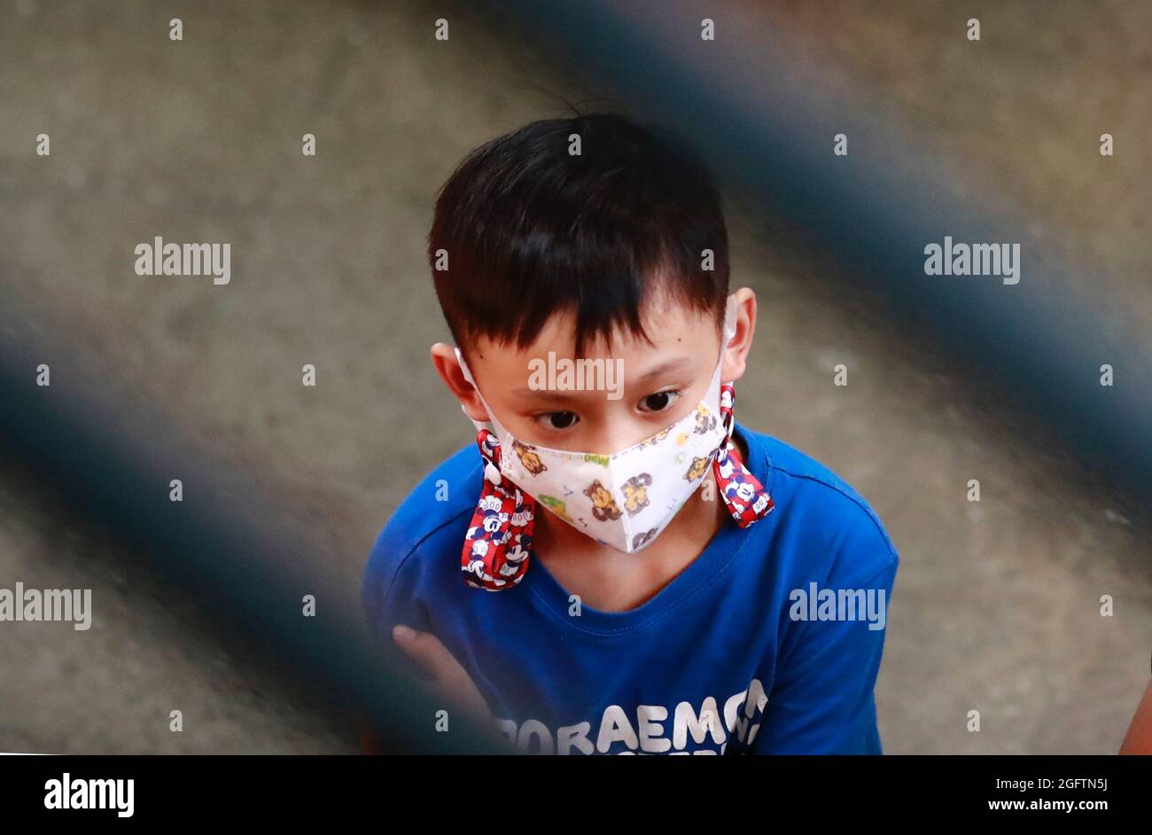Luodong, Taipei, Taiwan. 27th Aug, 2021. A boy wearing a face mask is ...