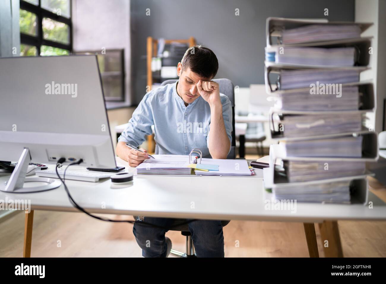 Male office employee using computer hi-res stock photography and images ...