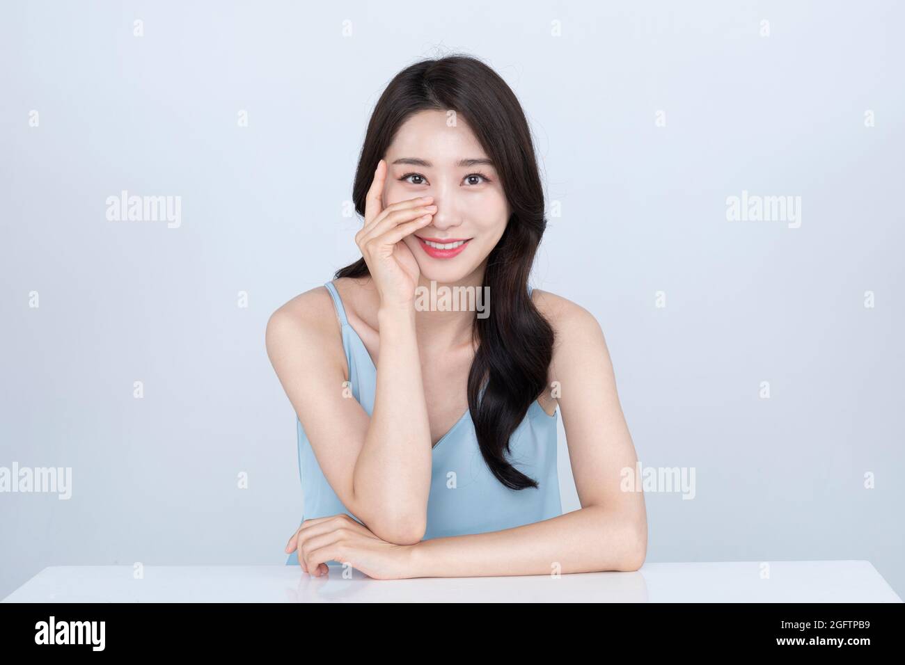 beautiful Korean Asian young woman model with hand motion, skin beauty ...