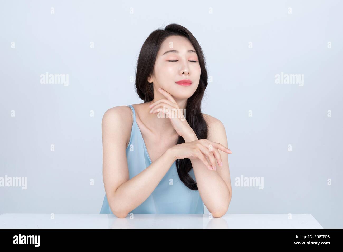 beautiful Korean Asian young woman model with hand motion, skin beauty ...