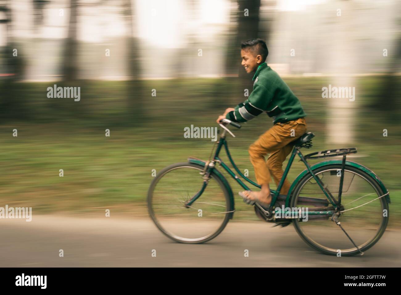Indian child cycle riding hi-res stock photography and images - Alamy