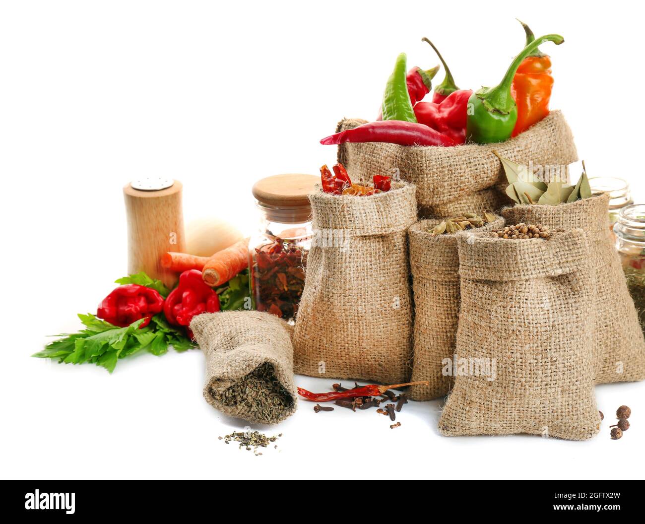 Spices in sacking bags on white background Stock Photo - Alamy