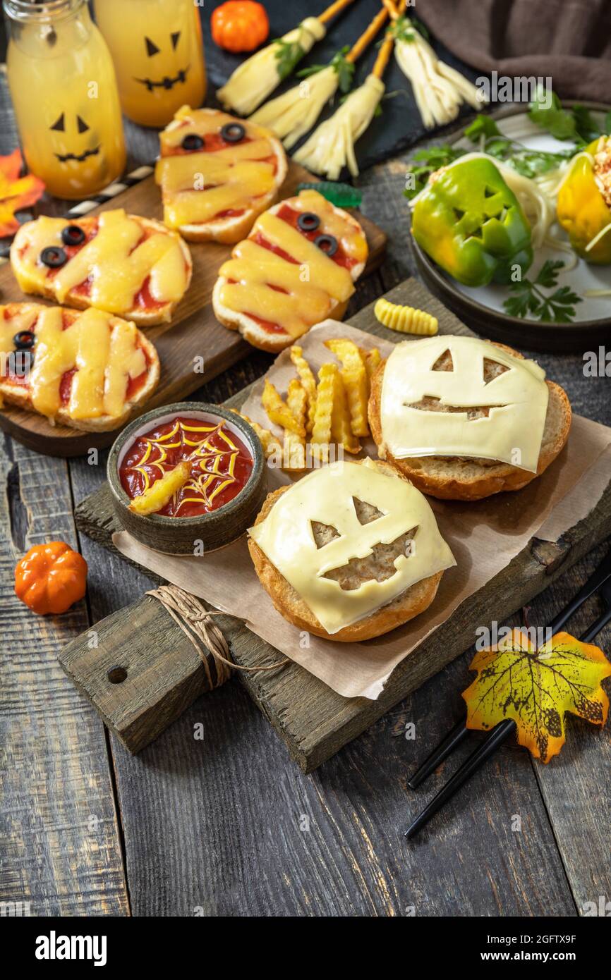 Halloween party food corner table scene over a wood background ...