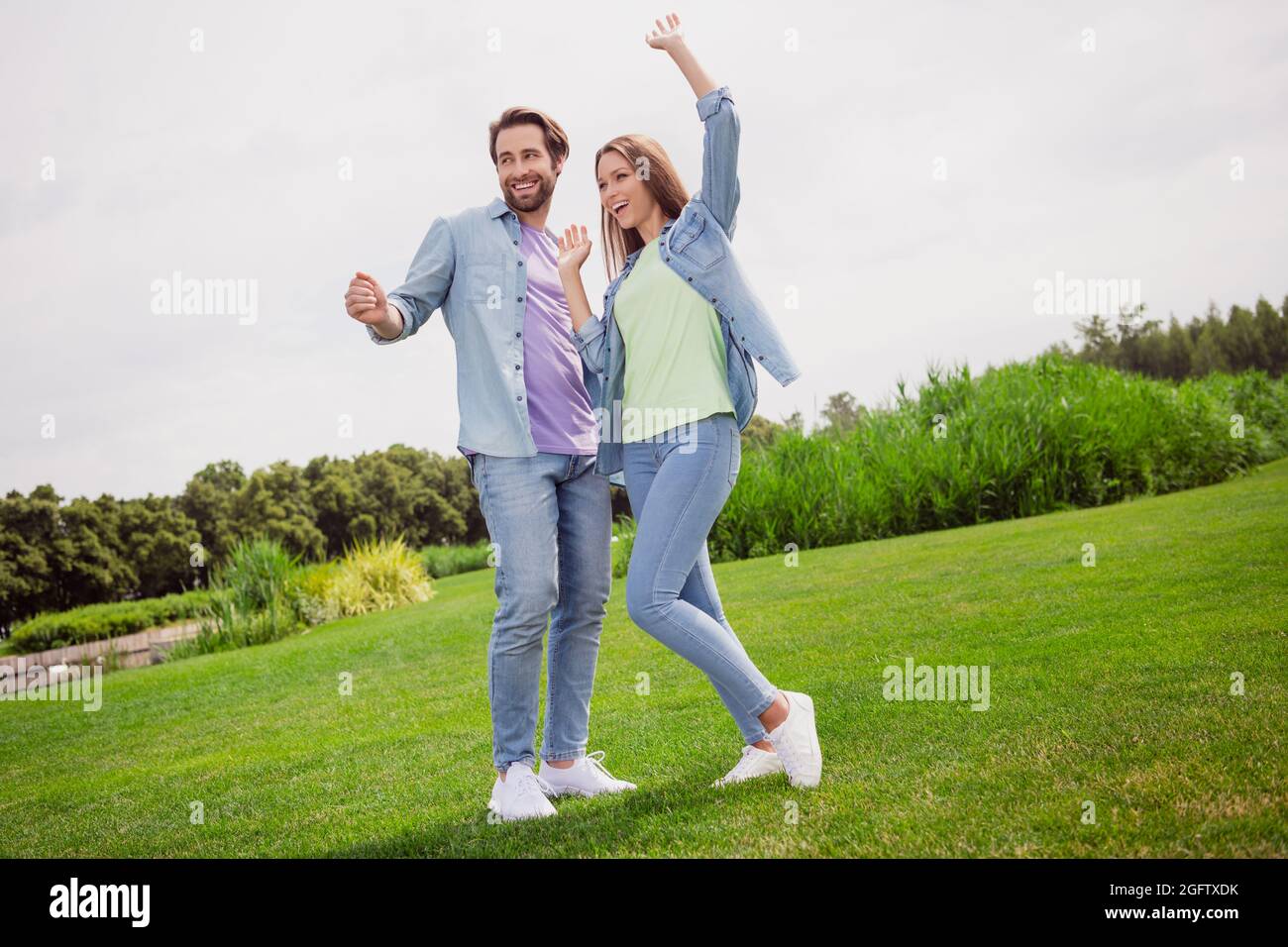 Full size photo of good mood cheerful couple dancing having fun ...