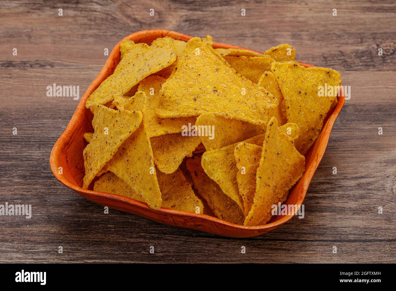 Mexican crunchy corn nachos triangle heap Stock Photo - Alamy