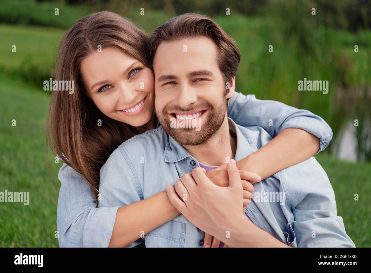 Portrait Of Smiling Lovely Good Looking Couple Hug Embrace Relaxing