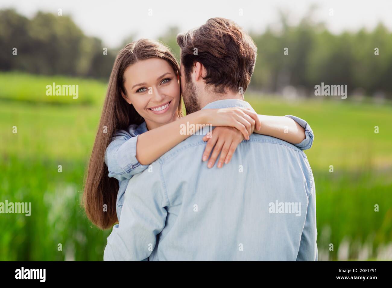 Photo of positive smiling cheerful female wife hug embrace husband ...