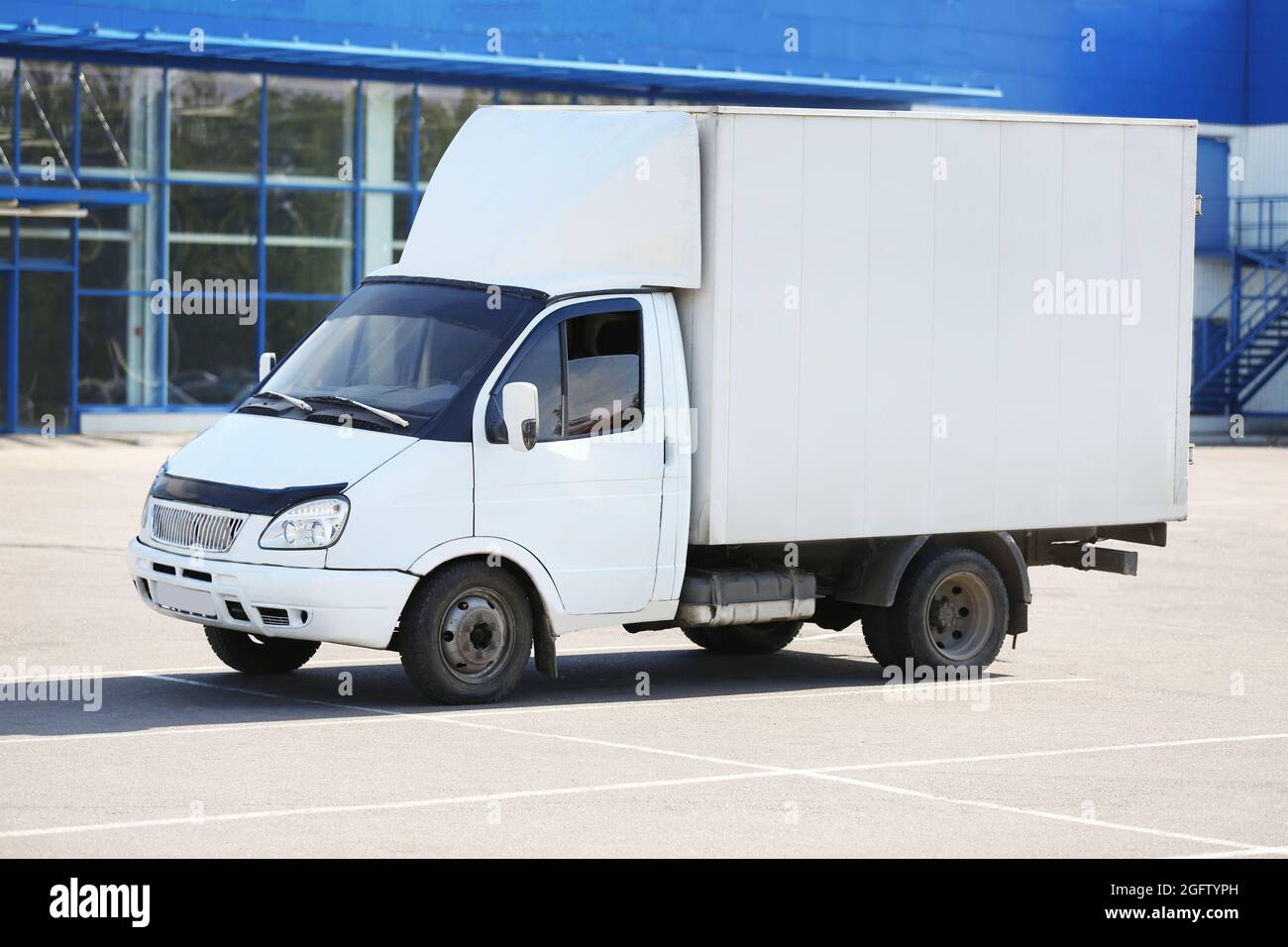 Side view of white cargo car Stock Photo - Alamy