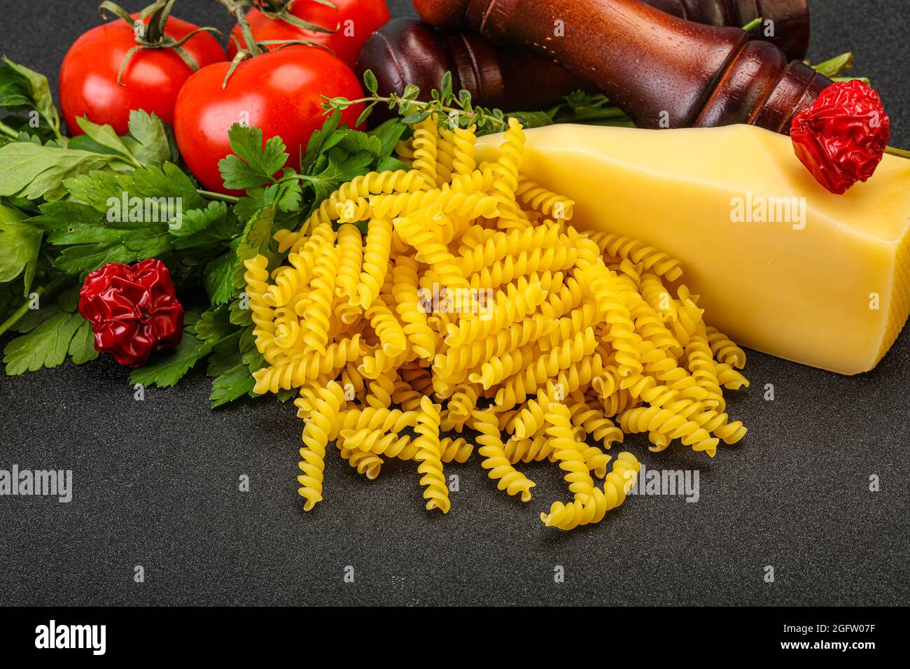 Raw Italian pasta Fusilli for cooking with vegetables Stock Photo - Alamy