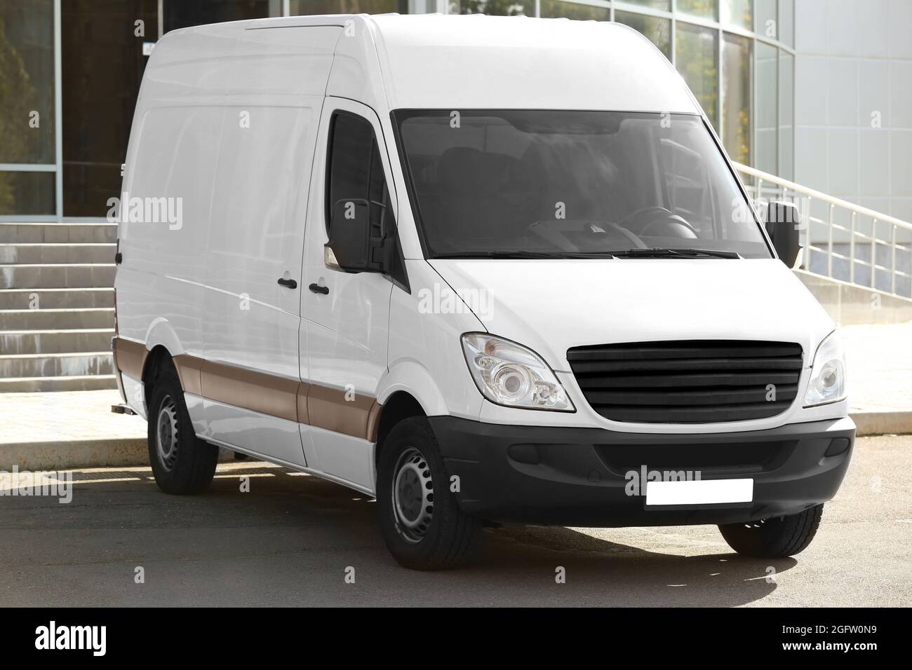 White van parked on street Stock Photo - Alamy