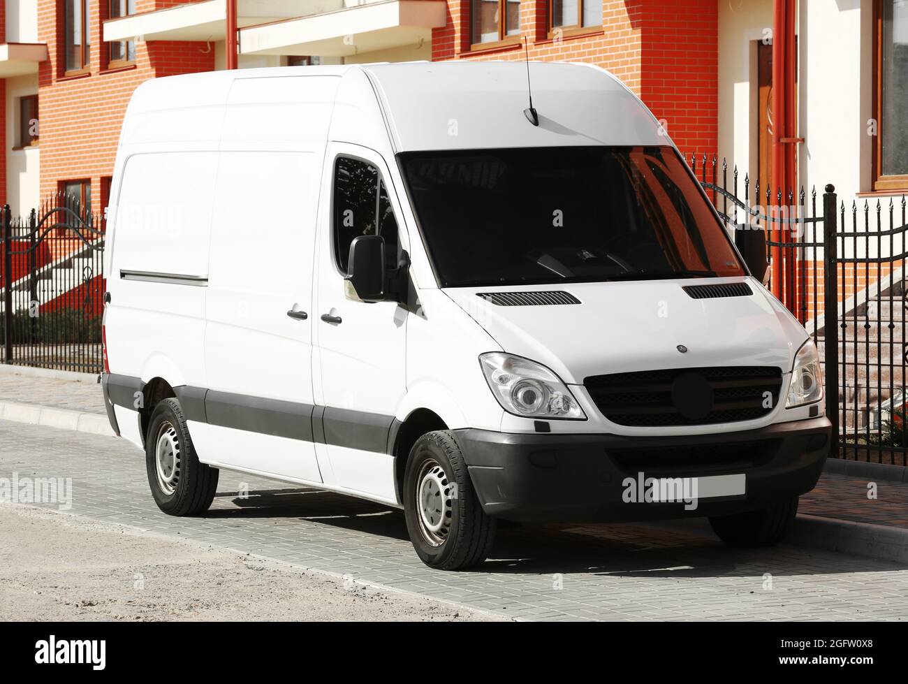 White van parked on street Stock Photo - Alamy