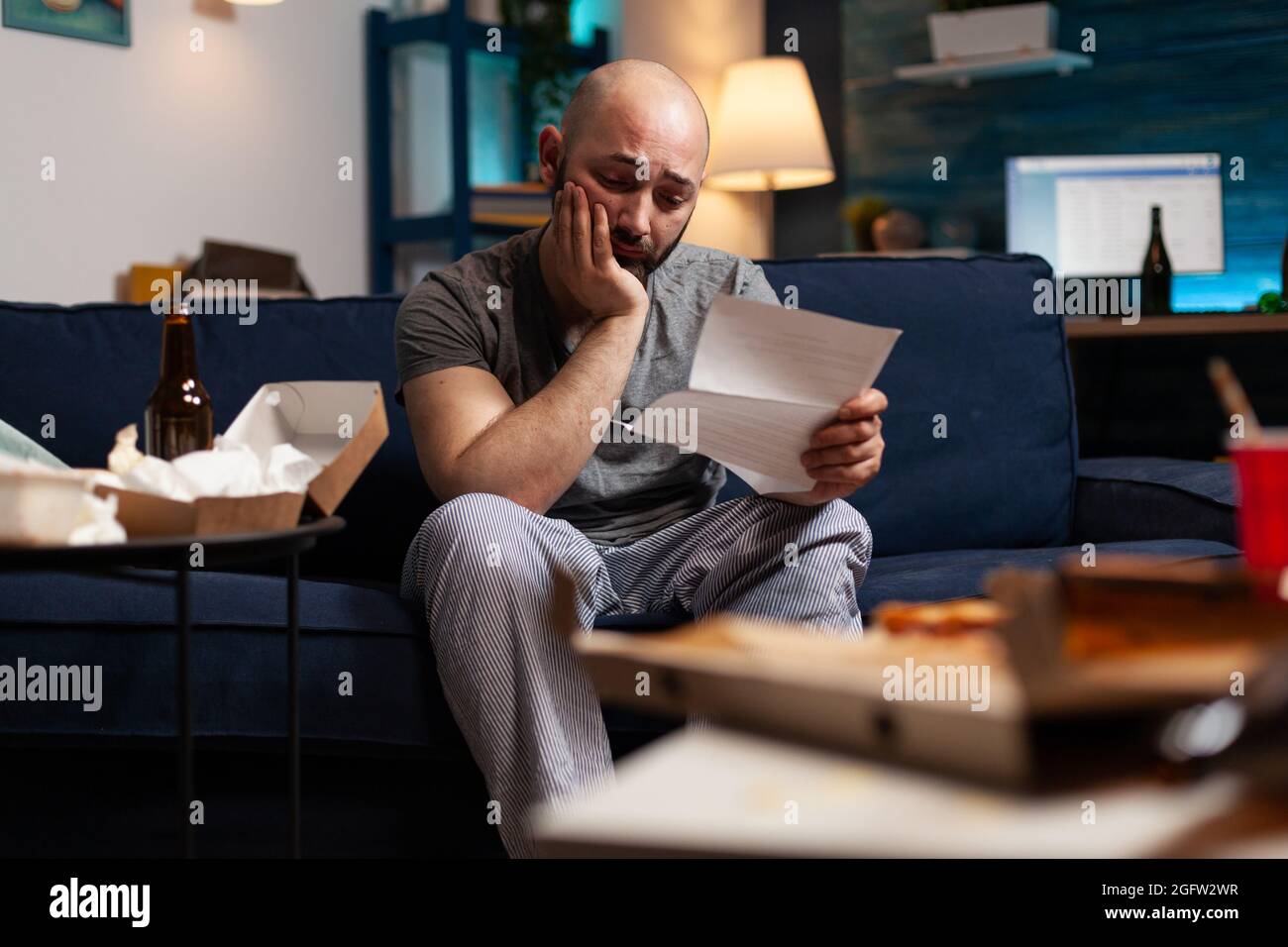 Crying man reading letter hi-res stock photography and images - Alamy