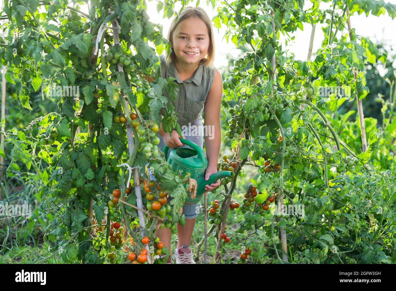 Smiling little girl at the farm Stock Photo - Alamy