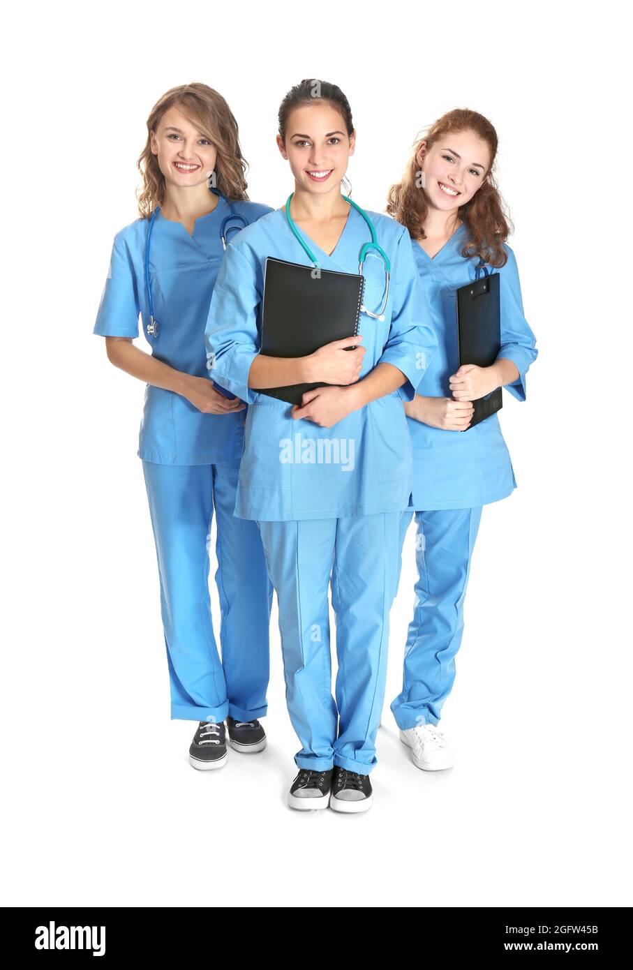 Young attractive doctors on white background Stock Photo - Alamy