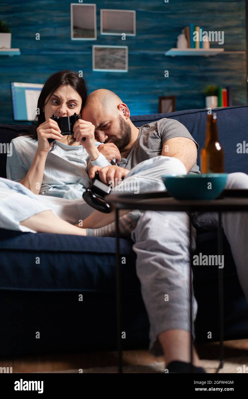 Furious nervous couple losing online videogames championship using ...