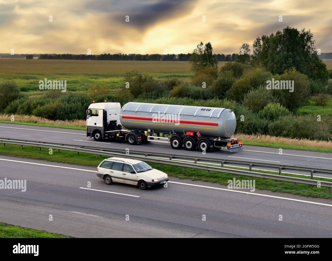 Isothermal Tank truck driving on highway. Oil and Gas Transportation ...