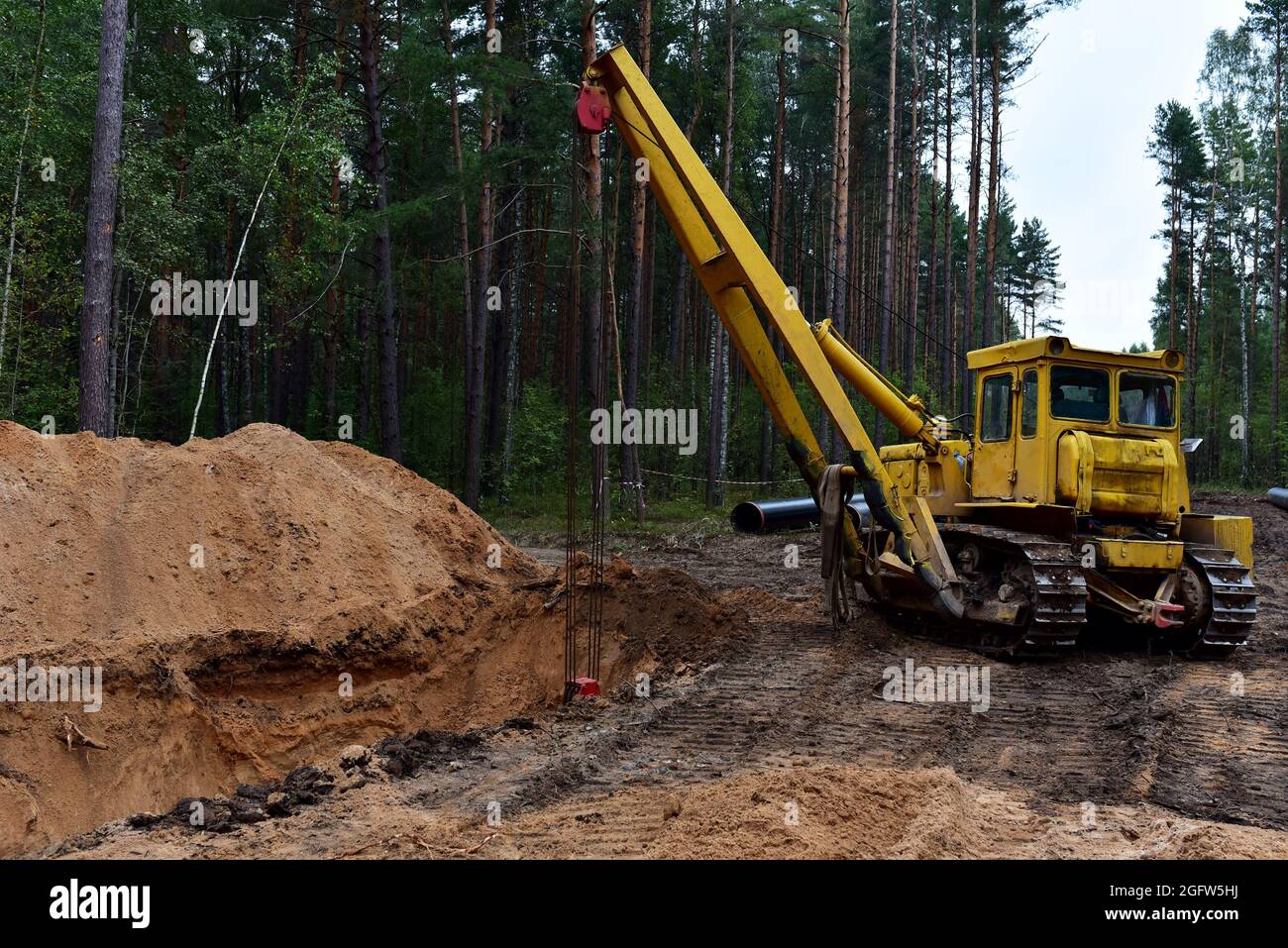 Natural Gas Pipeline Construction. Laying oil pipe in a trench in the ...