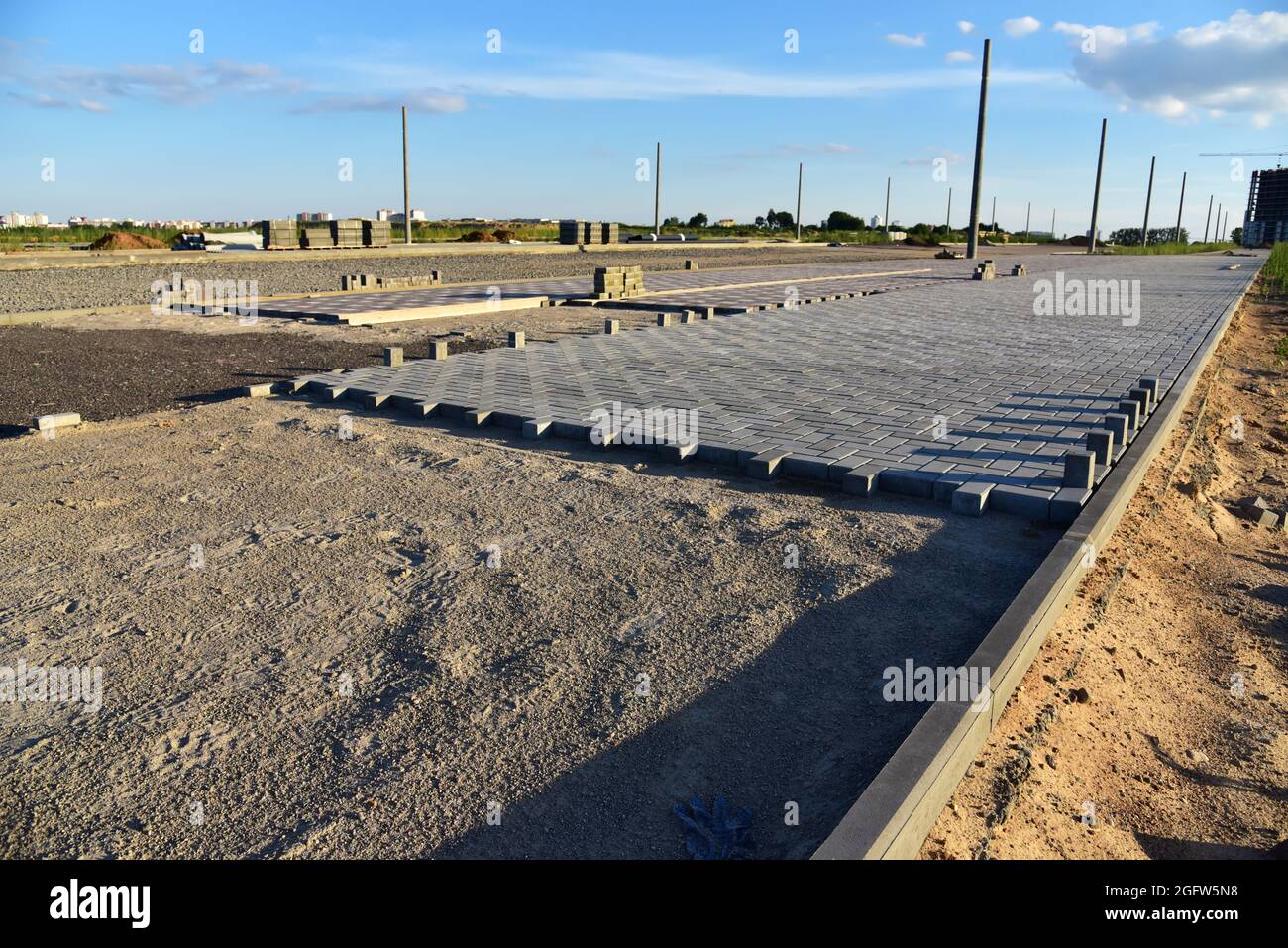 Laying paving slabs at construction site. Process of installing paving ...