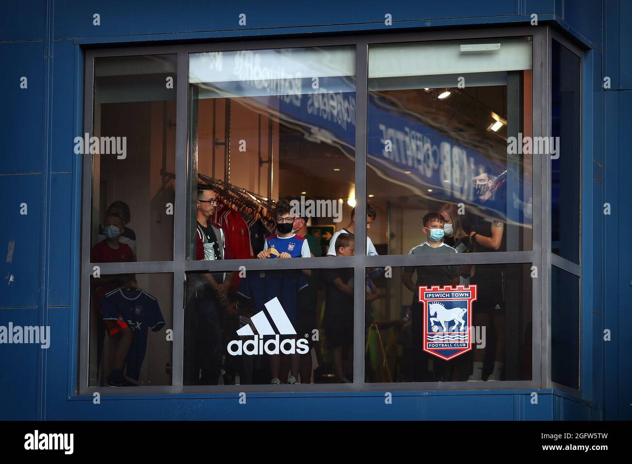 Supporters look on from the Planet Blue store - Ipswich Town Portman ...