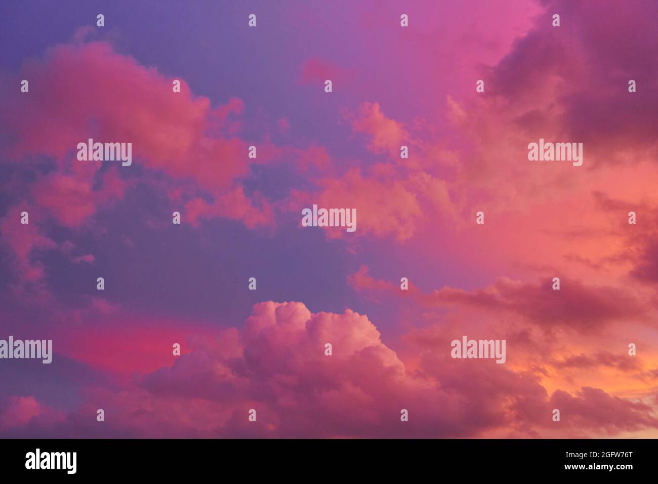 Incredible red sunset clouds against the blue sky Stock Photo - Alamy