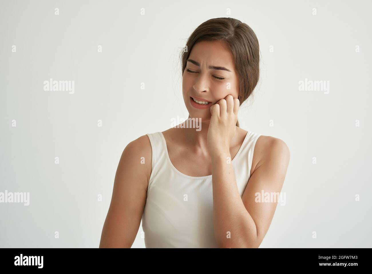 disgruntled woman holding face toothache health problems Stock Photo ...