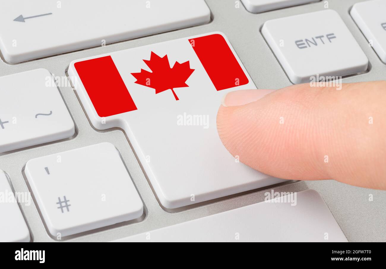 A keyboard with a labeled button - Flag of Canada Stock Photo - Alamy