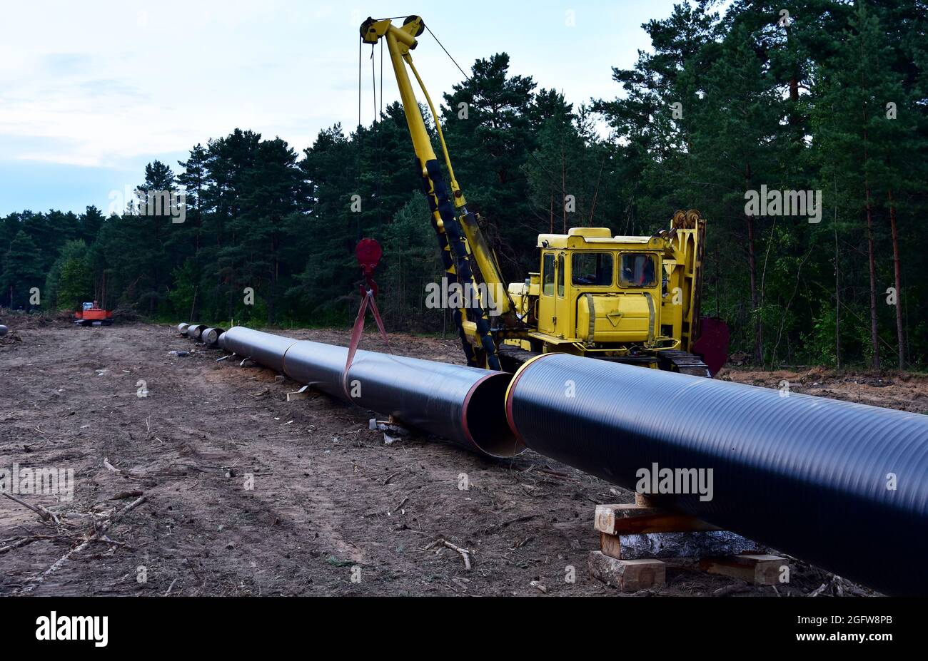 Natural Gas Pipeline Construction. Laying oil pipe in a trench in the ...