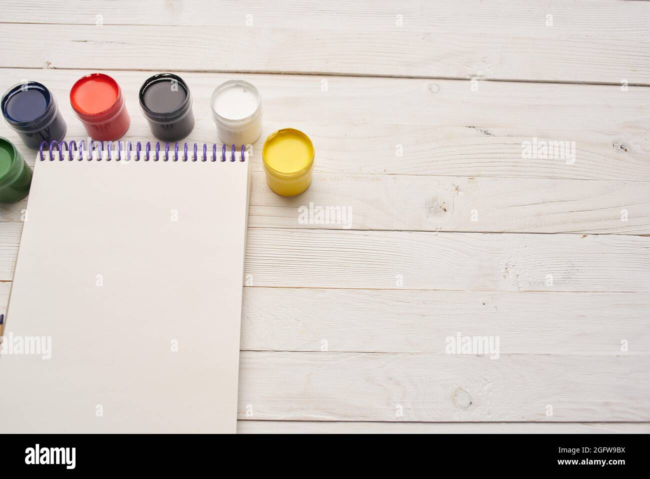 drawing pad watercolor paints pencils tools for artist Stock Photo - Alamy