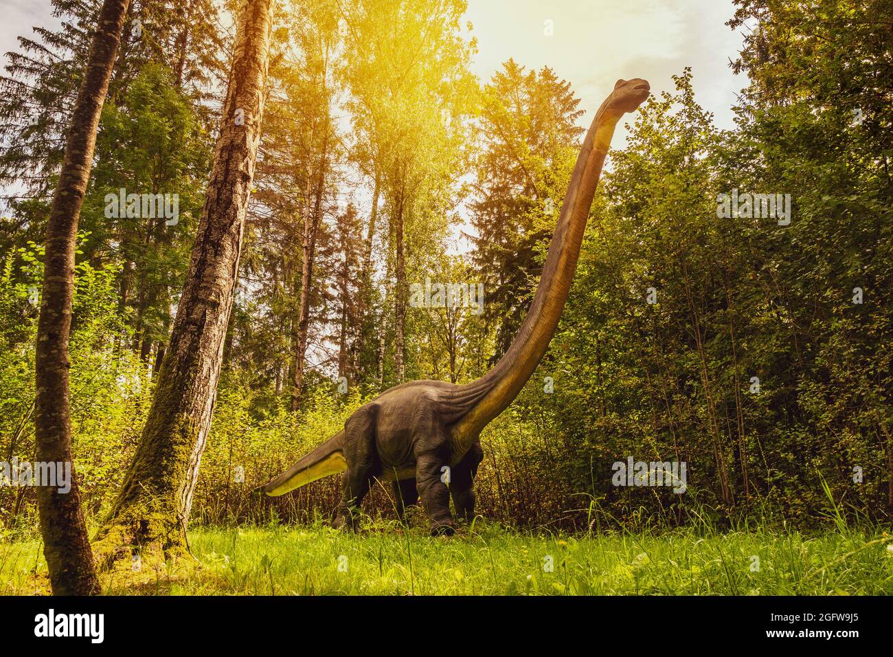 Big model of prehistoric dinosaur in the nature. Realistic scenery ...