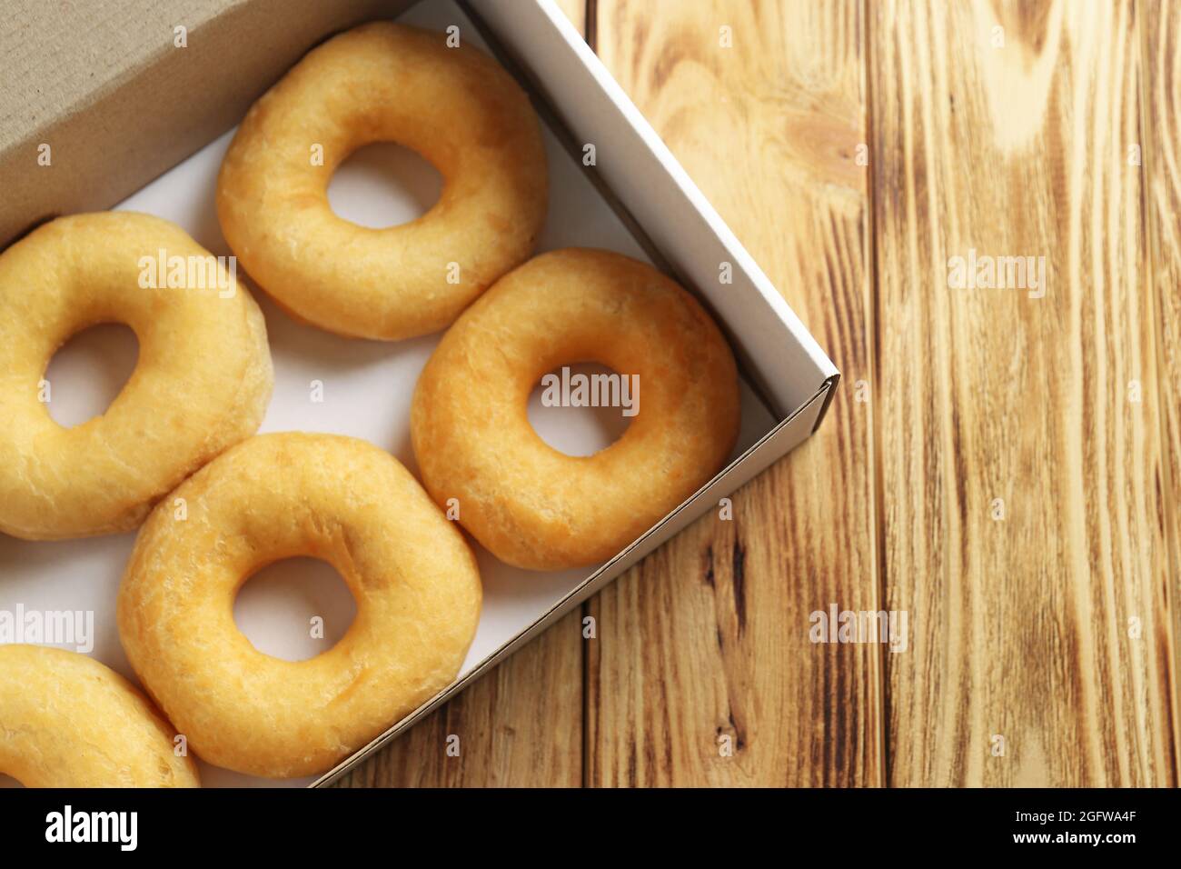 Delicious donuts in a cardboard box Stock Photo - Alamy