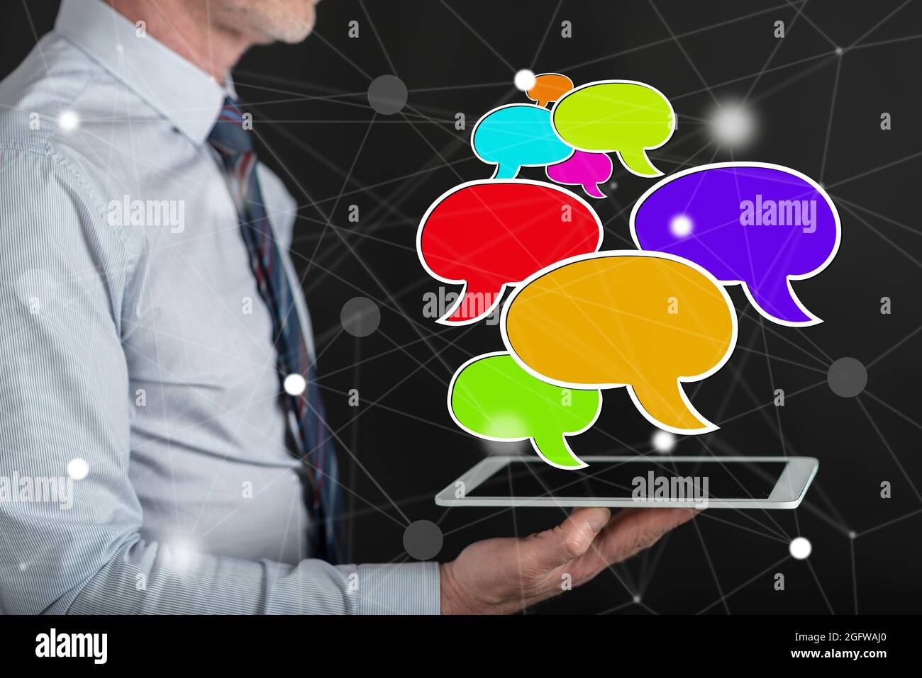 Communication concept above a tablet held by a man Stock Photo - Alamy