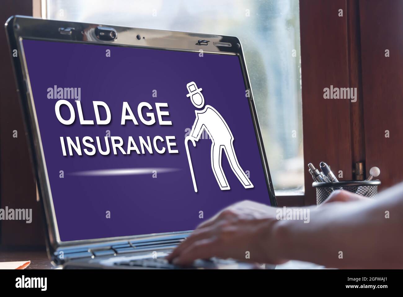 Laptop screen displaying an old age insurance concept Stock Photo - Alamy