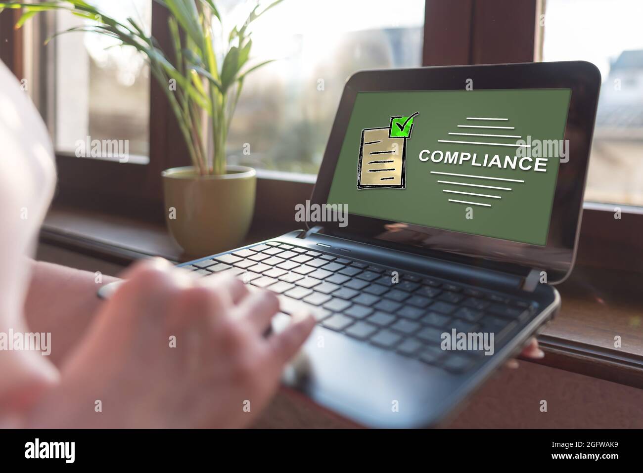 Laptop screen displaying a compliance concept Stock Photo - Alamy
