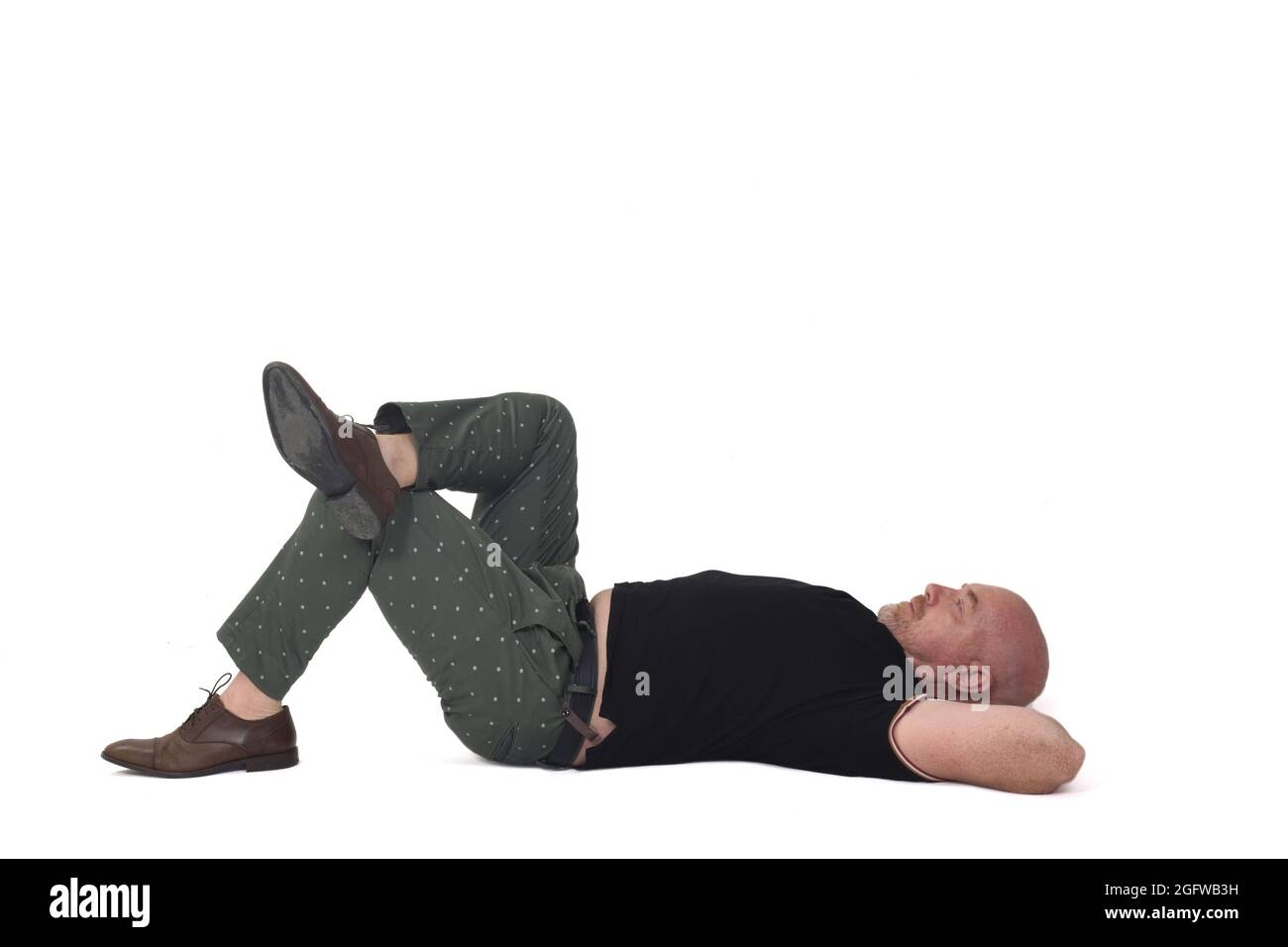 relaxed man lying on a floor on white background Stock Photo - Alamy