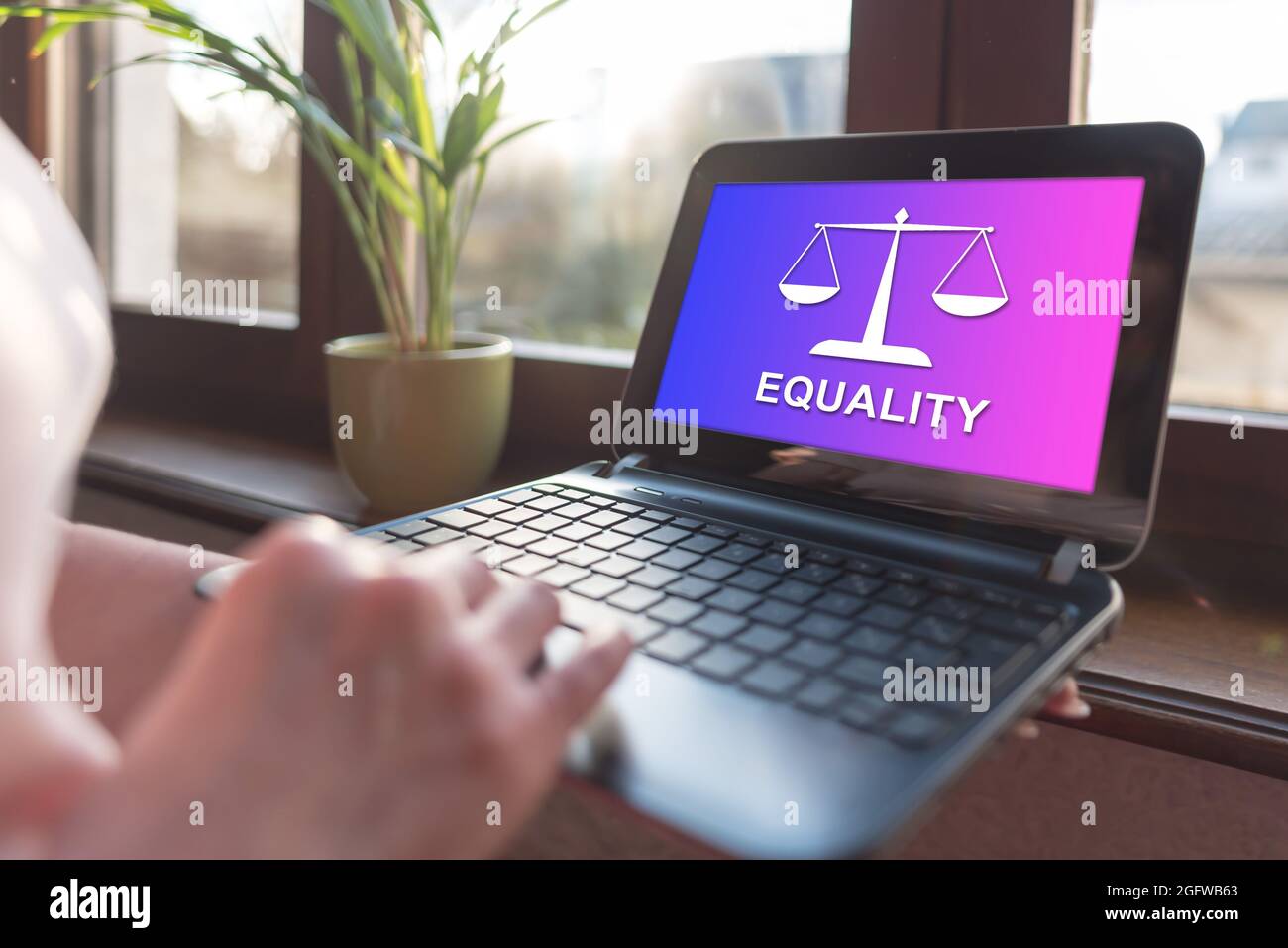 Laptop screen displaying an equality concept Stock Photo - Alamy