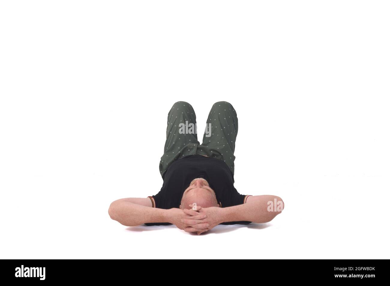 relaxed man lying on a floor on white background Stock Photo - Alamy