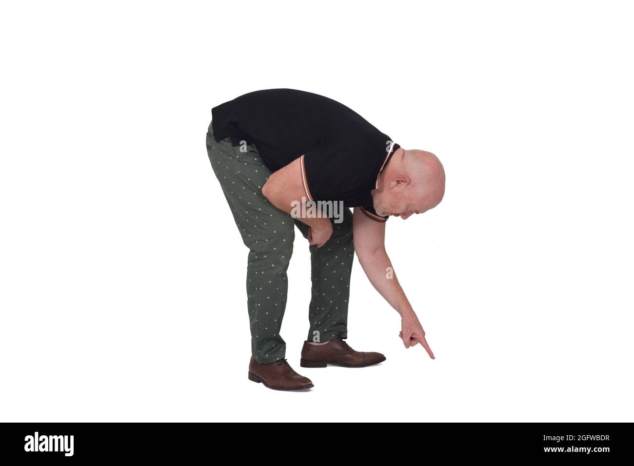 man crouching and pointing the floor on white background Stock Photo ...