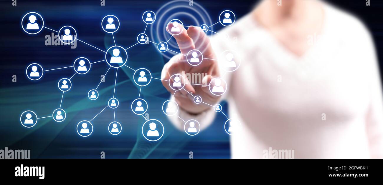 Woman touching a social media network on a touch screen with her ...