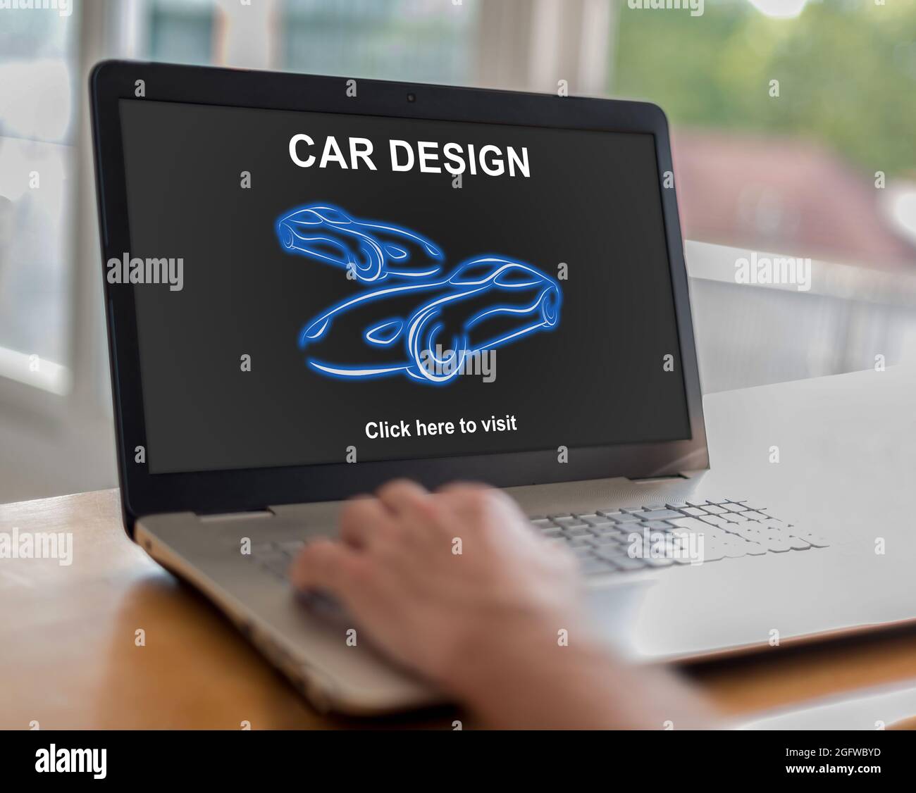 Man using a laptop with car design concept on the screen Stock Photo ...