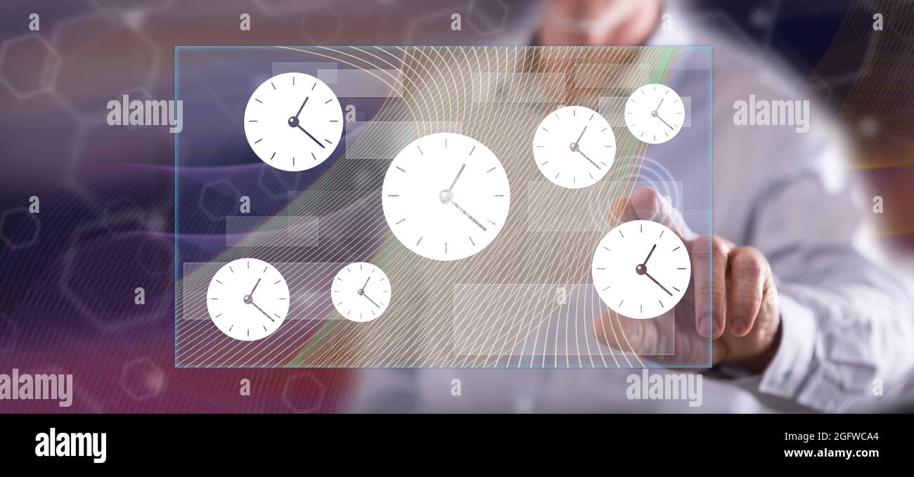 Man touching a time management concept on a touch screen with his ...