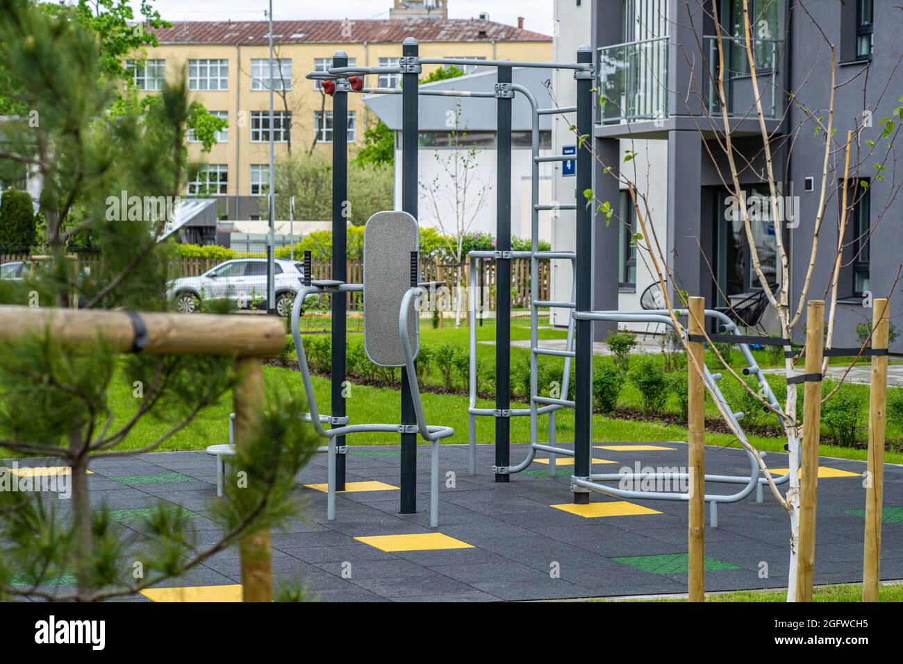 Modern exterior of residential building. New exercise equipment on ...
