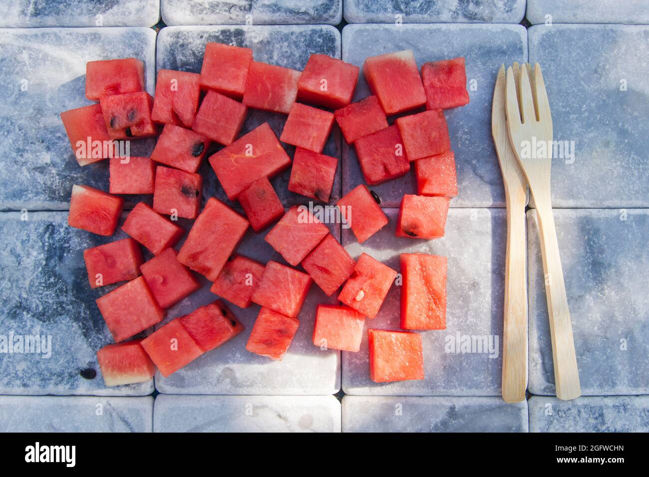 Presentation of a summer dish made of diced watermelon Stock Photo - Alamy