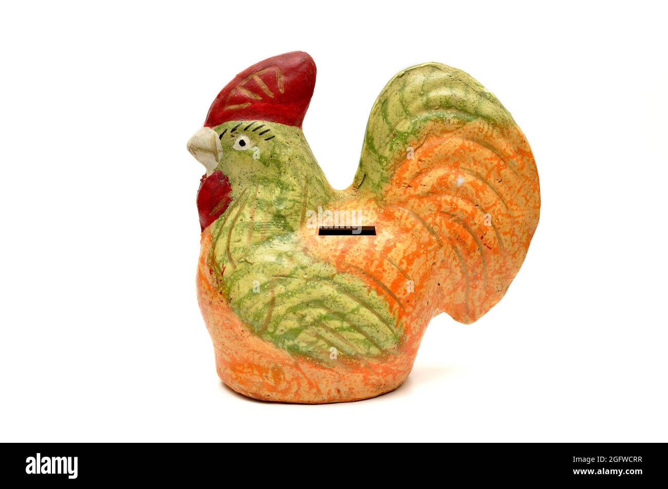 Colorful chicken piggy banks made of ceramic on a white background ...