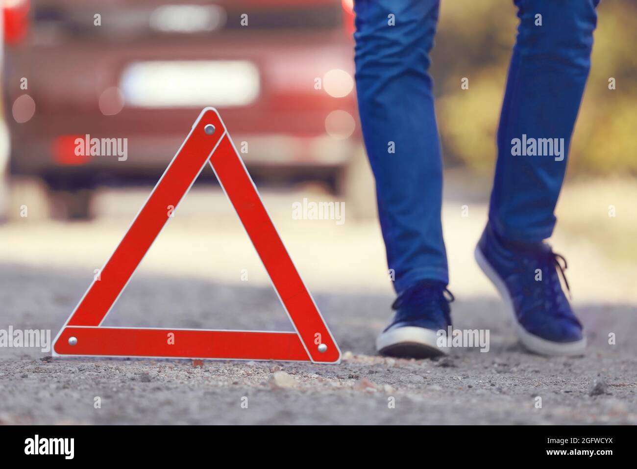 Car standing near stop sign hi-res stock photography and images - Alamy