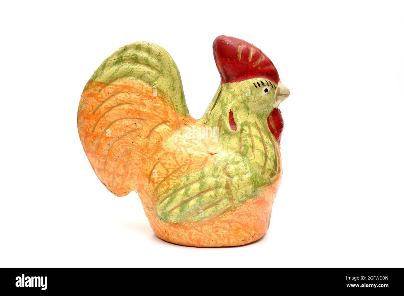 Colorful chicken piggy banks made of ceramic on a white background ...